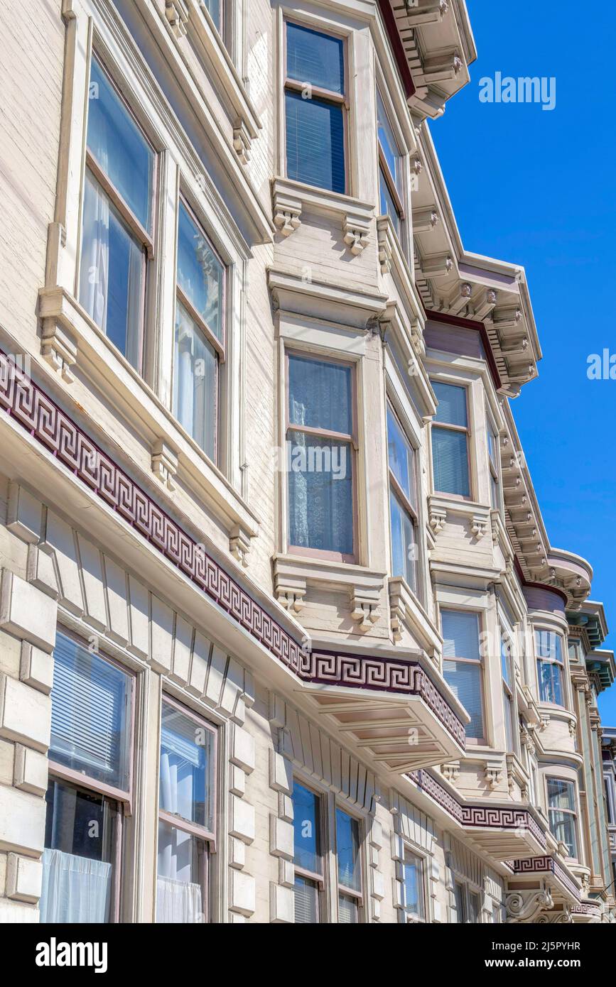 Low angle view of a residential building with bay windows and ornate ...