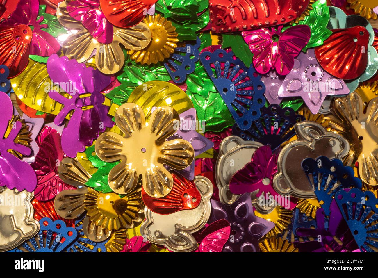 Metallic sequins of different colors and shapes Stock Photo - Alamy