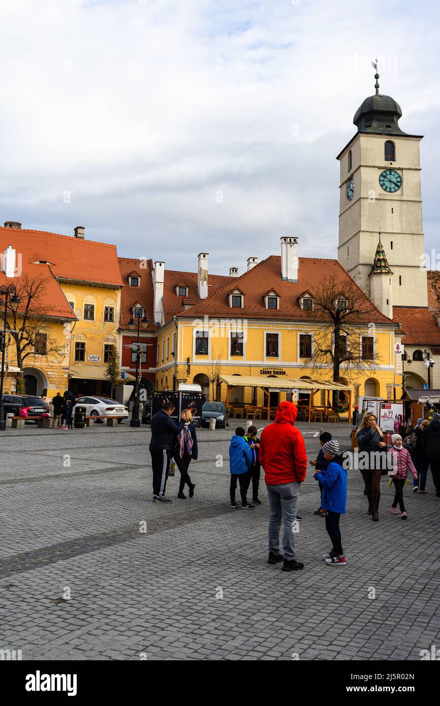 People and tourists wandering on the streets of old town Sibiu, Romania ...