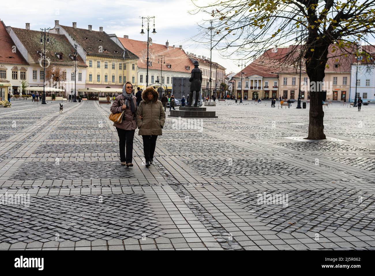People and tourists wandering on the streets of old town Sibiu, Romania ...