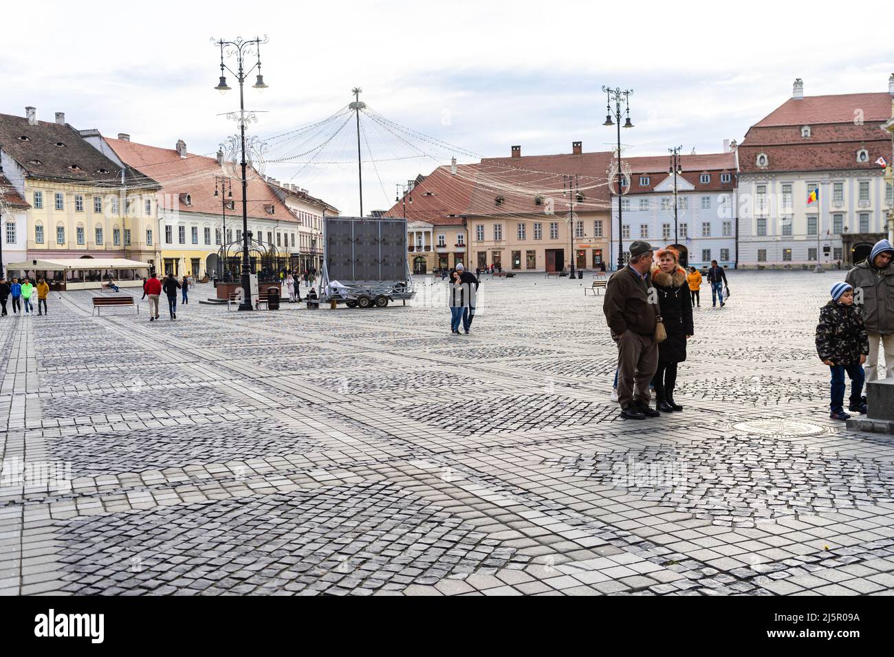 People and tourists wandering on the streets of old town Sibiu, Romania ...