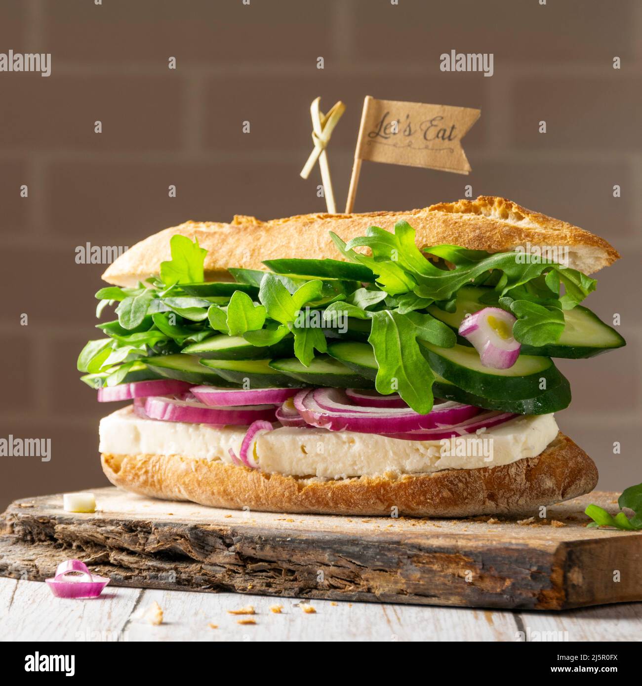 Homemade sandwich with goat cheese and fresh raw vegetables Stock Photo ...