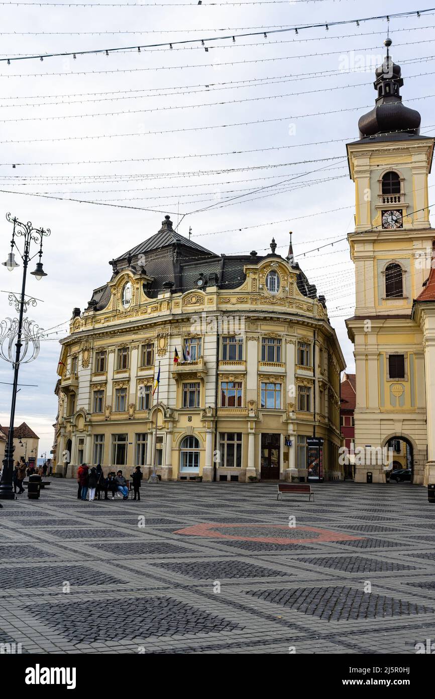 People and tourists wandering on the streets of old town Sibiu, Romania ...