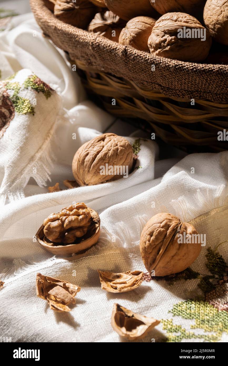 Whole walnuts in basket, food harvest, rustic style Stock Photo - Alamy