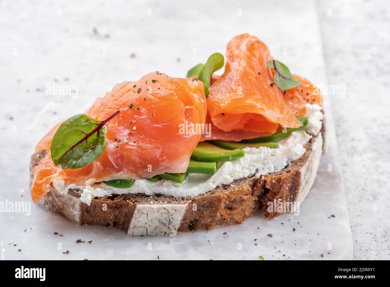 Smoked salmon and avocado on toast Stock Photo - Alamy