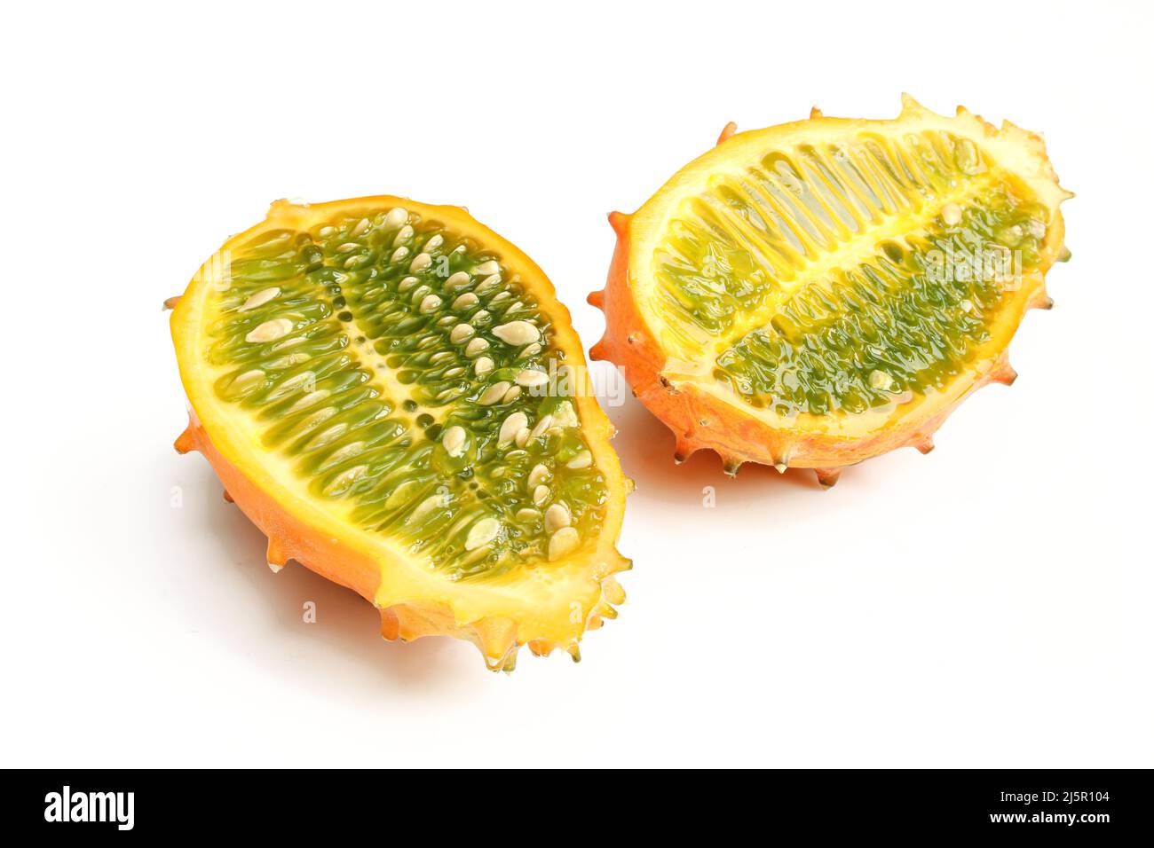 Two parts of sliced kiwano fruit isolated on white background Stock ...
