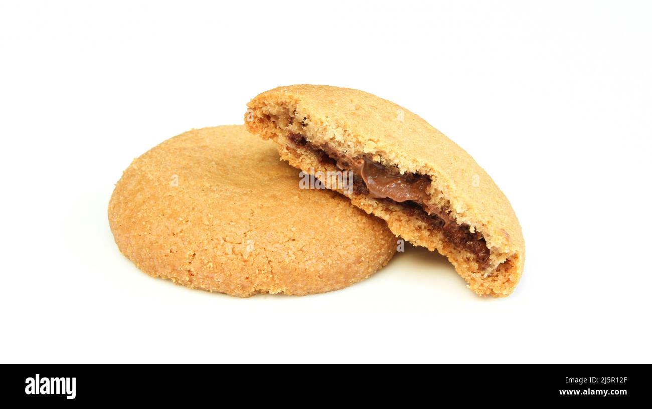 Cracked cookies stuffed with chocolate filling isolated on white ...