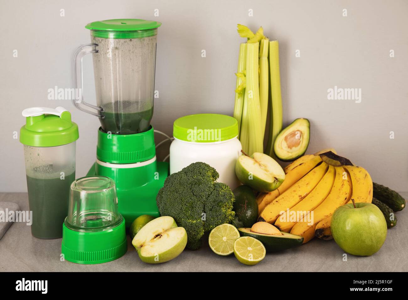 Blender, ingredients for healthy homemade smoothie on kitchen table ...