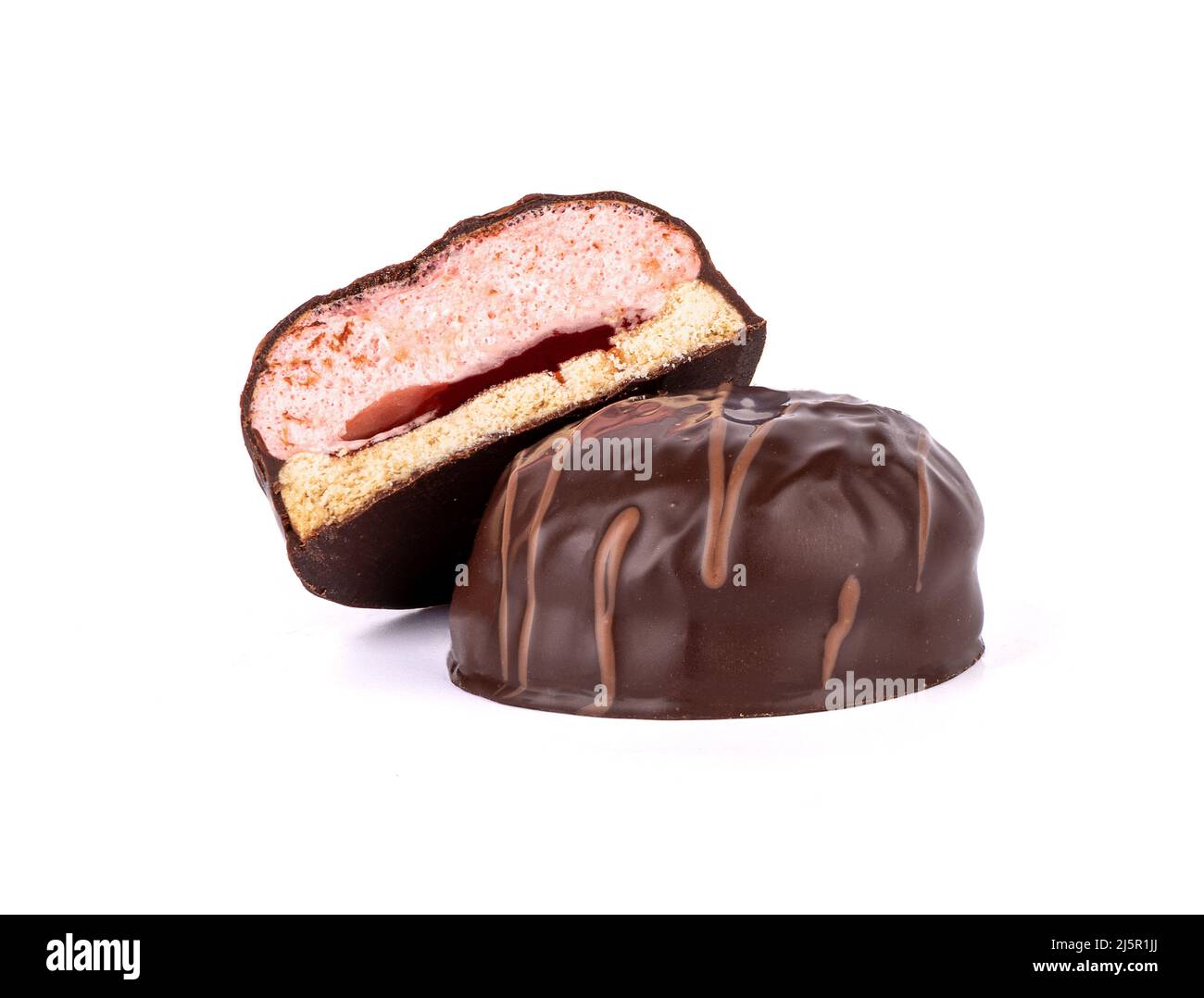 Closeup sweet dessert souffle in chocolate with pink filling. Cutaway ...