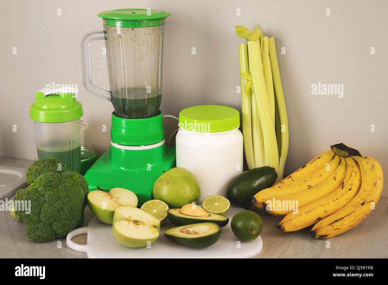 Blender, ingredients for healthy homemade smoothie on kitchen table ...