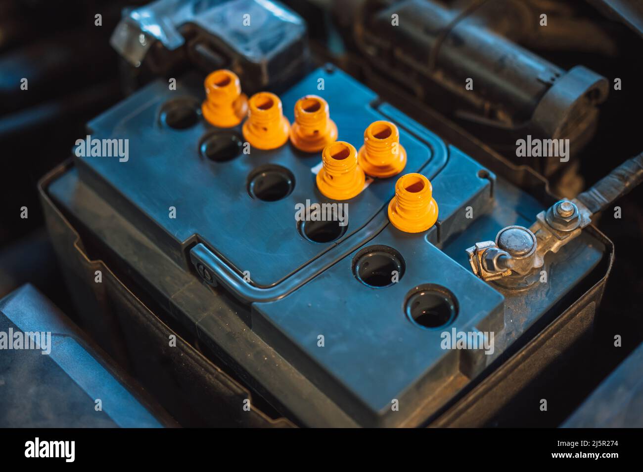 Car battery in car with plugs removed Stock Photo - Alamy