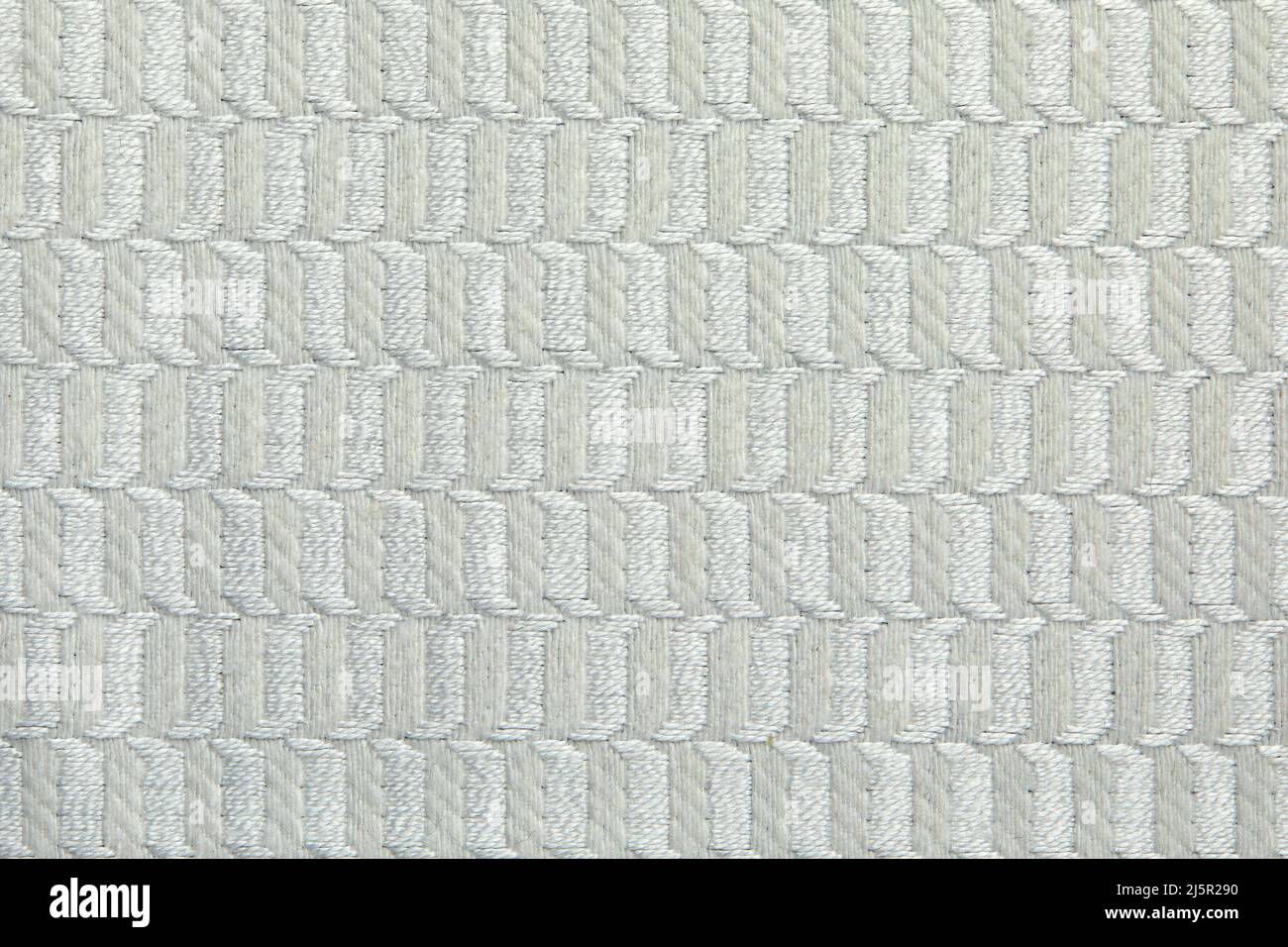 Knitted texture. Texture of jacquard fabric with gray beige geometric ...