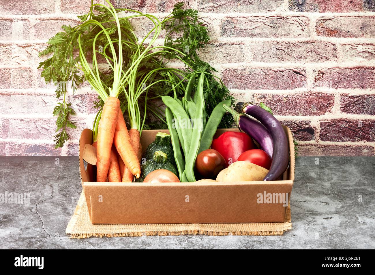 Cardboard box full of fresh vegetables. Vegetarian and vegan food ...