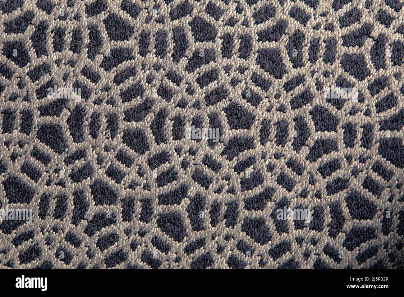 Abstract circular print background on cotton fabric in gray biege tone ...