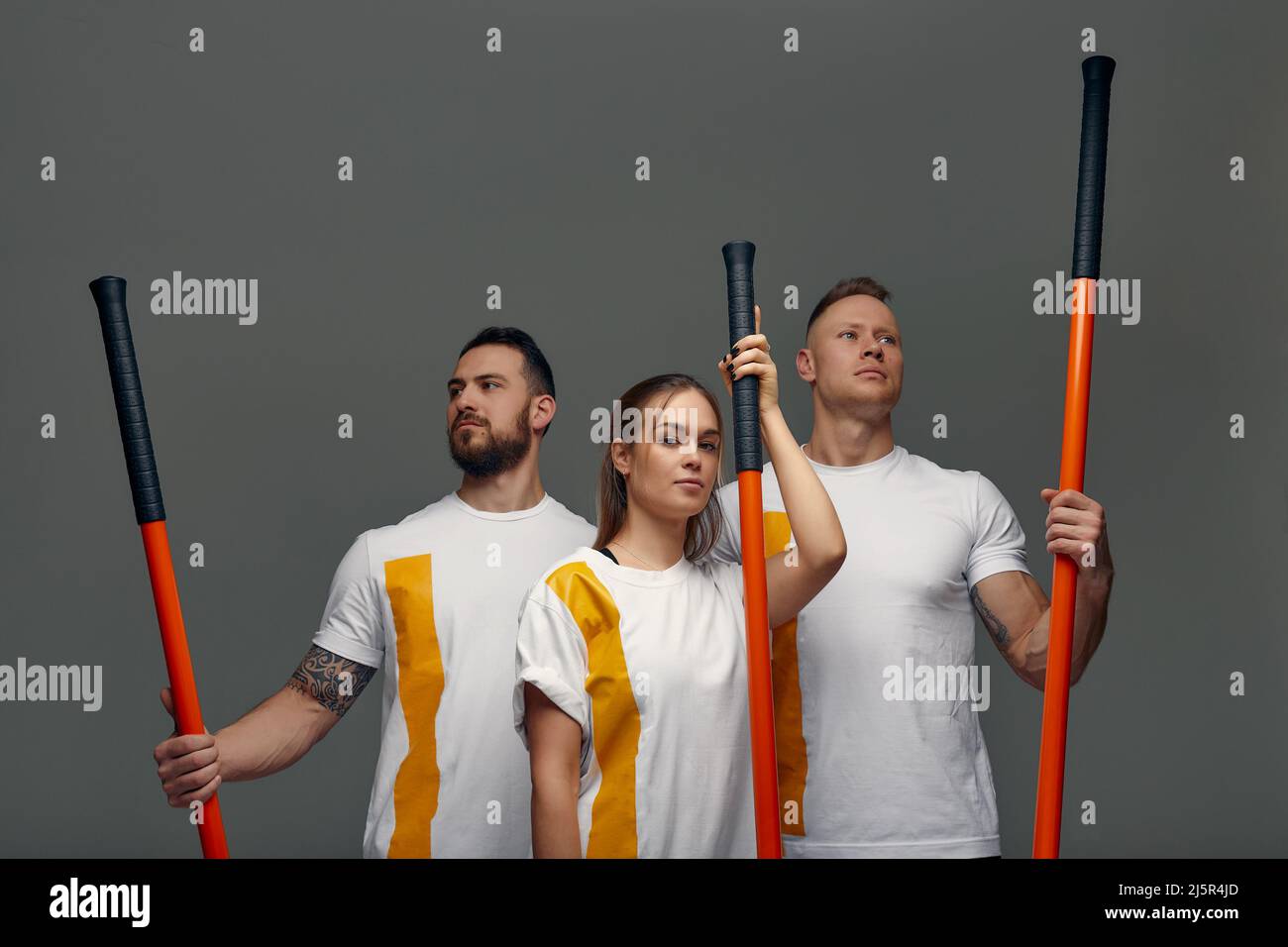 People stand together and practice sticks. Karate masters posing with ...