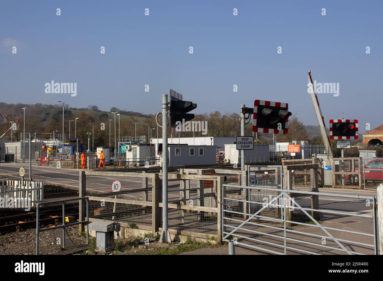 EXETER, UK - MARCH 1, 2021 barrier coming down at The Red Cow crossing ...