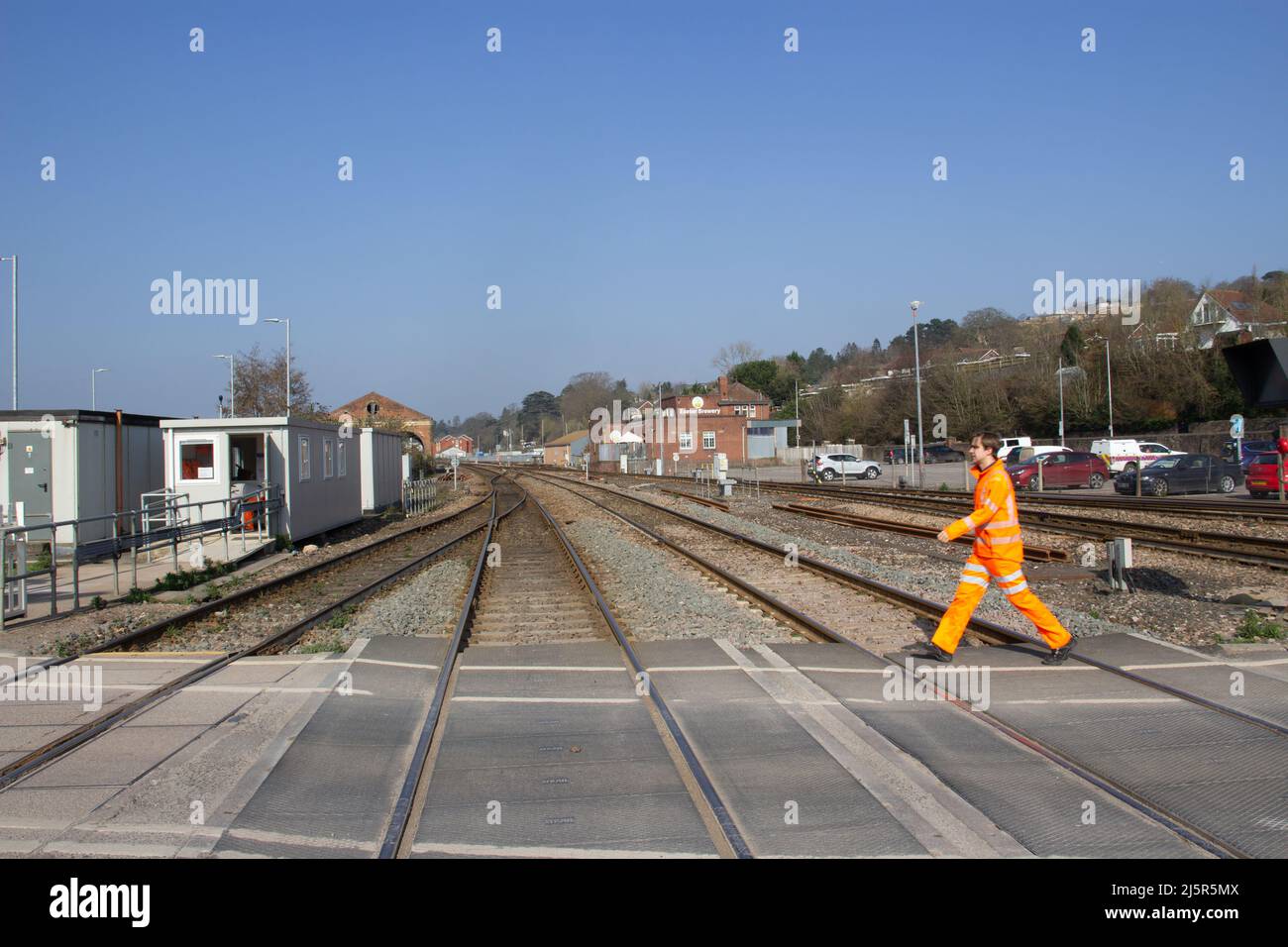 EXETER, UK - MARCH 1, 2021 worker on Red Cow crossing at Exeter St ...