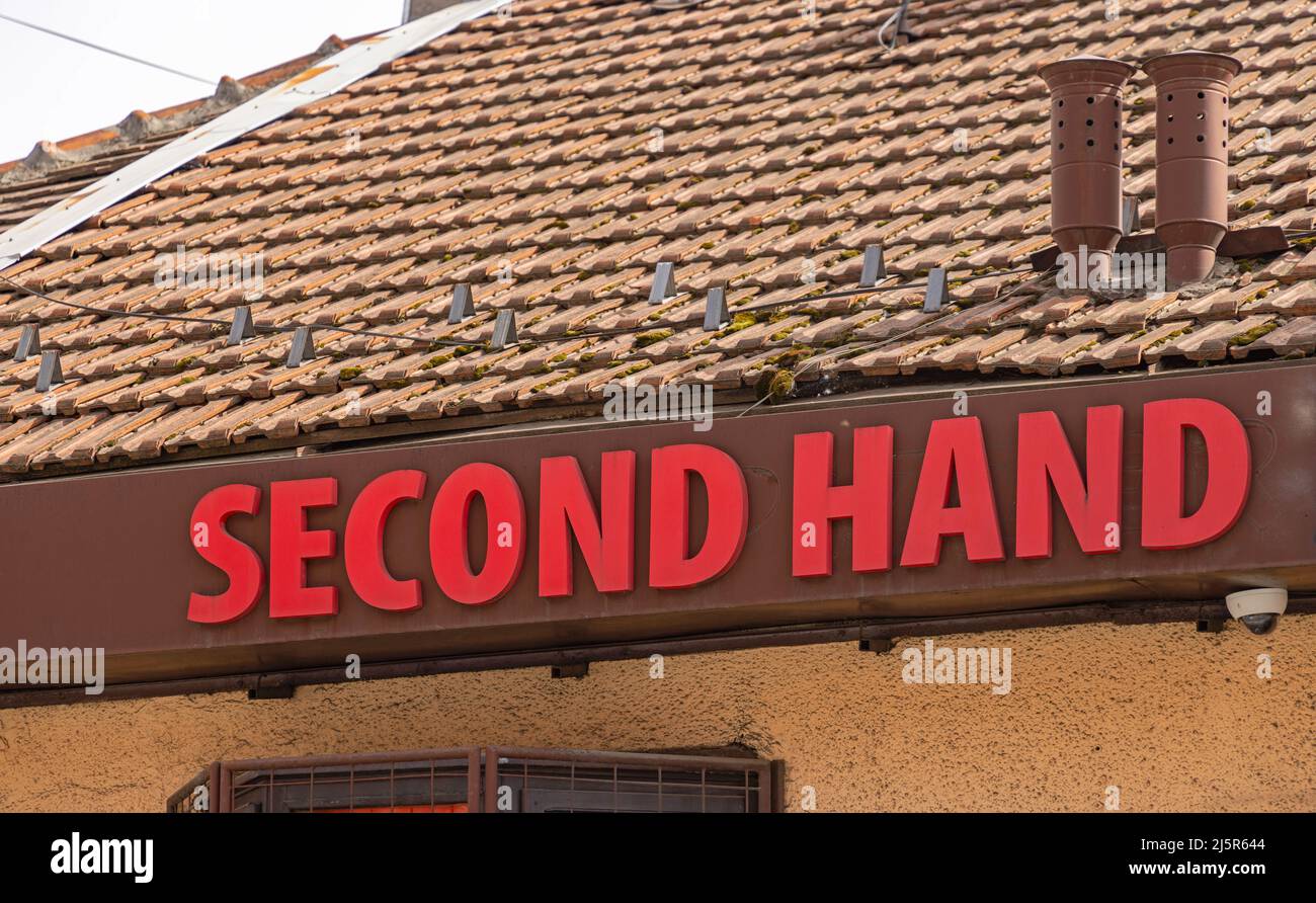 Big Red Sign Second Hand at Shop Front Stock Photo - Alamy