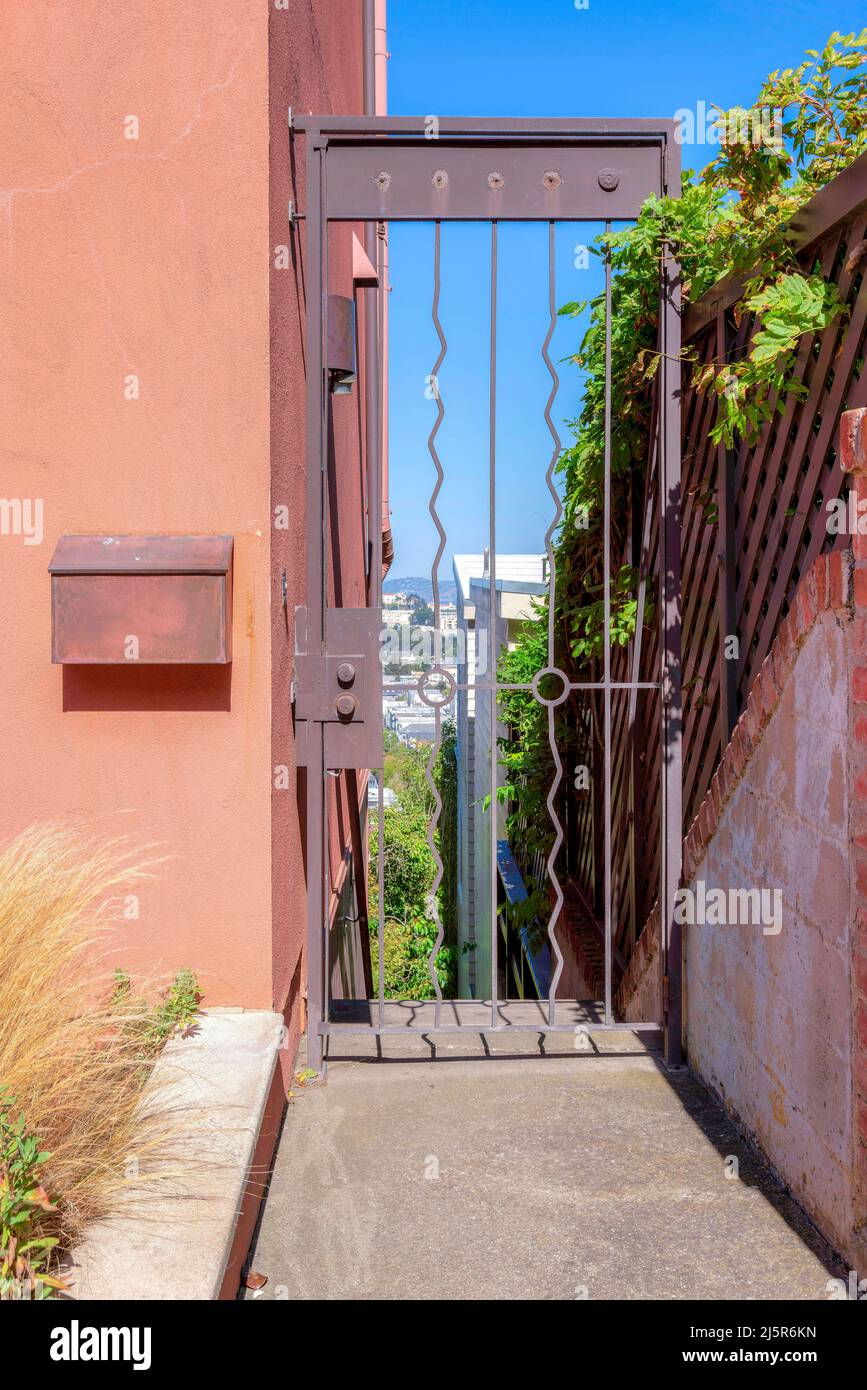 Single metal door gate with mailbox on the wall at San Francisco ...