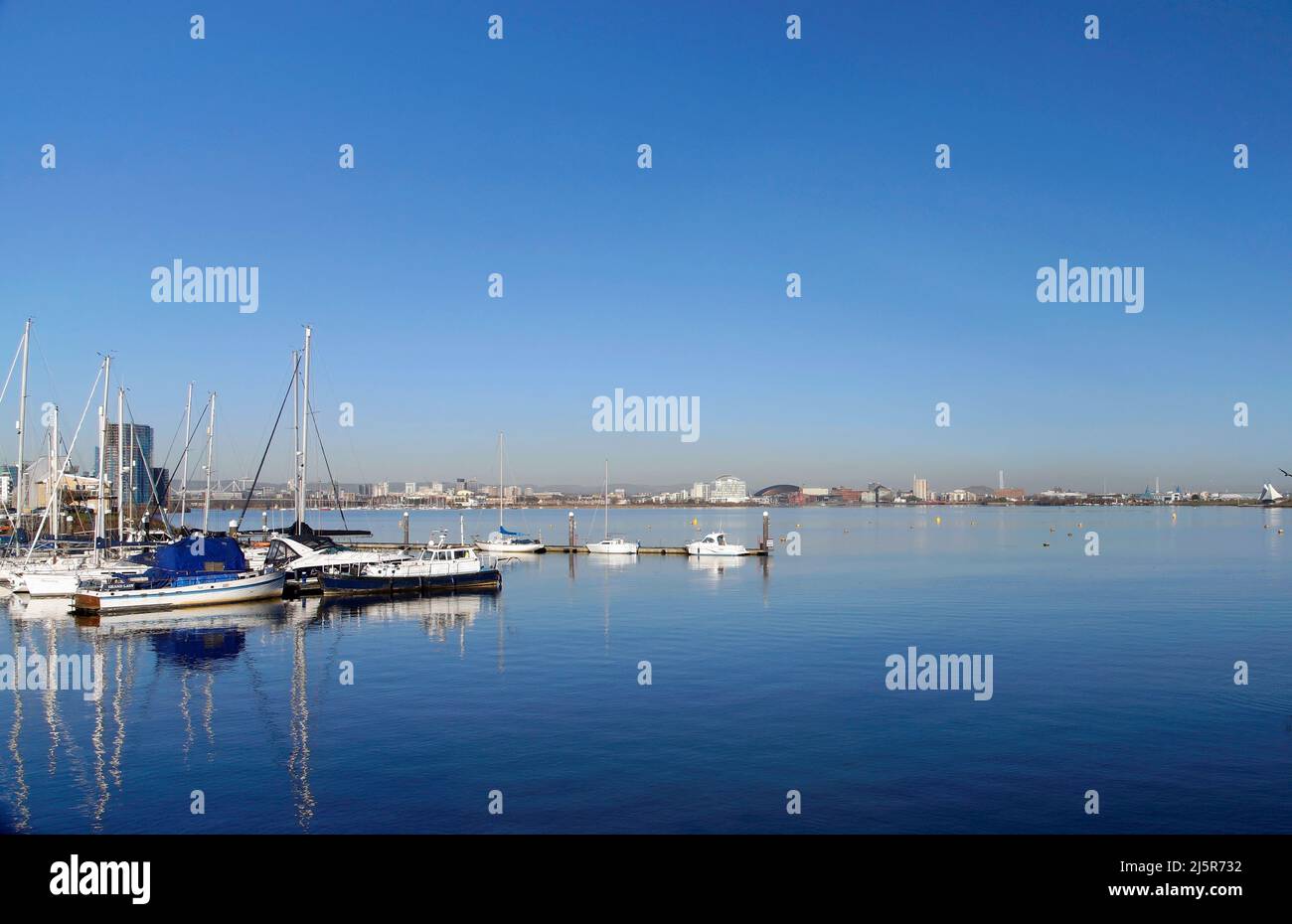 Yachts at moorings, Cardiff Bay with Millennium Centre and barrage on ...