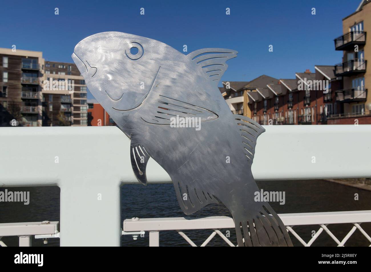 Shiny, metal fish sculptures on a bridge at Roath Basin, Cardiff Bay ...