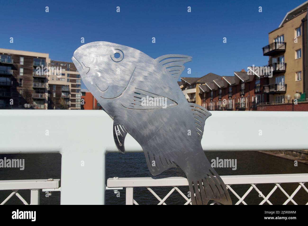 Shiny, metal fish sculptures on a bridge at Roath Basin, Cardiff Bay ...