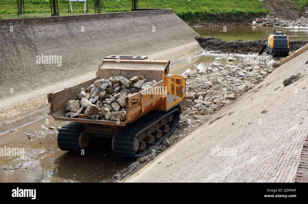 Construction works in the dry riverbed Stock Photo - Alamy