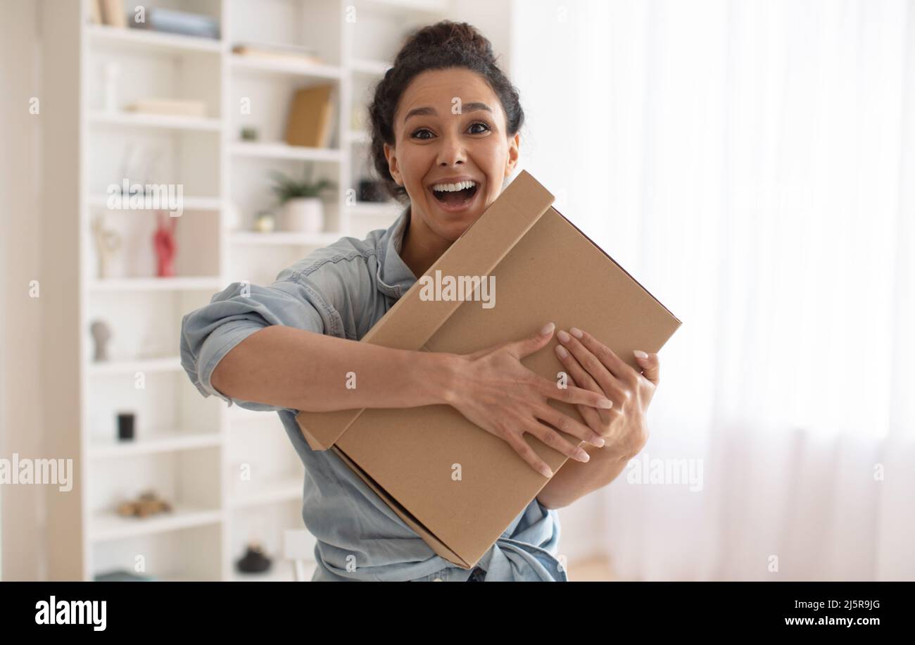 Joyful Lady Customer Holding Cardboard Standing At Home Stock Photo - Alamy
