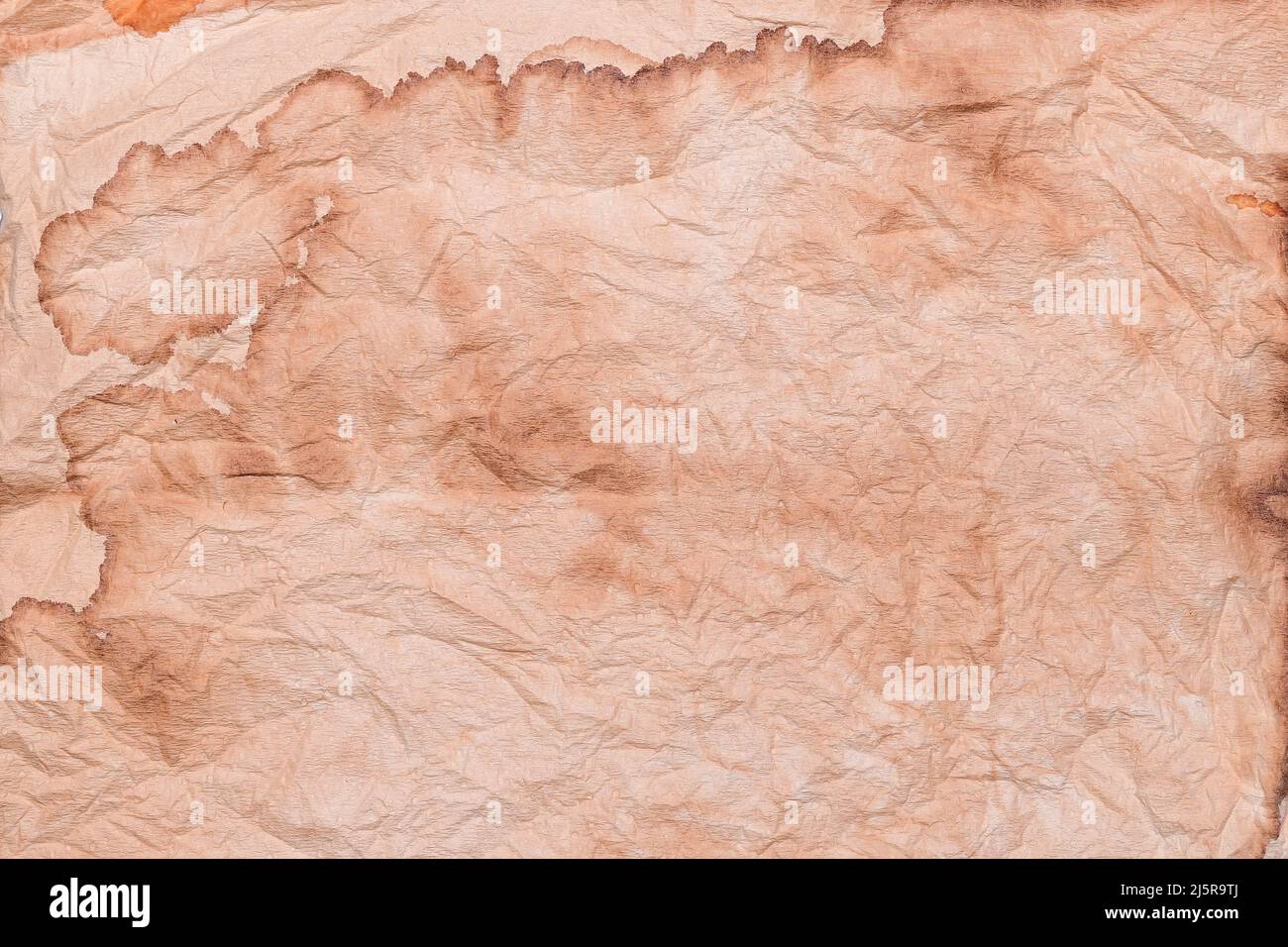 Old brown crumpled paper hi-res stock photography and images - Alamy