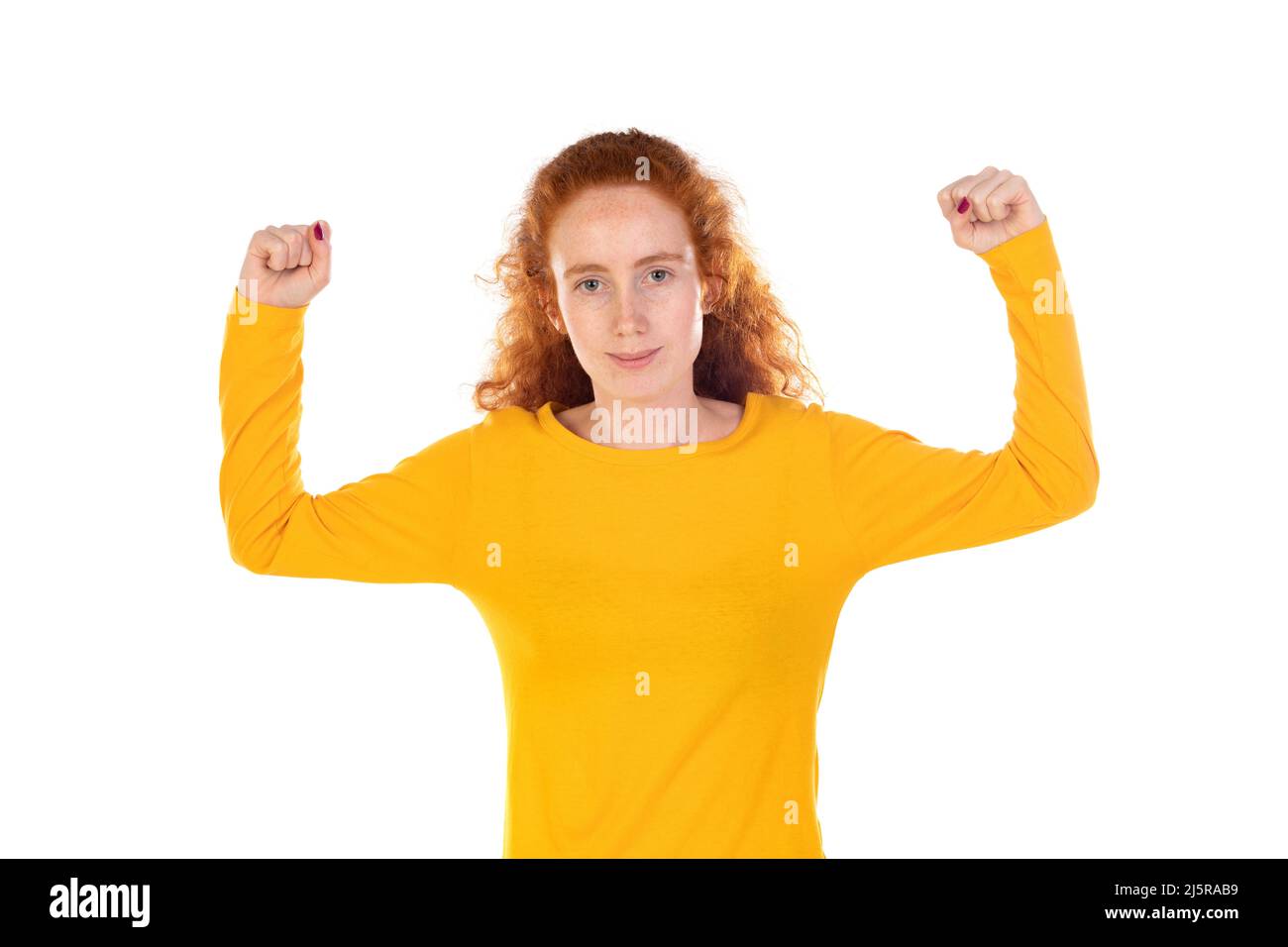 Teenager redhead girl over isolated white background celebrating a ...