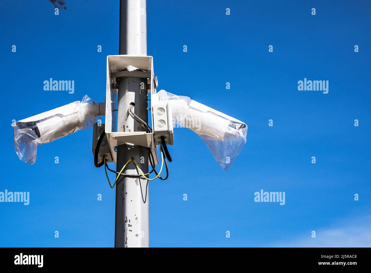 installation of CCTV cameras on a pole in a public place Stock Photo ...