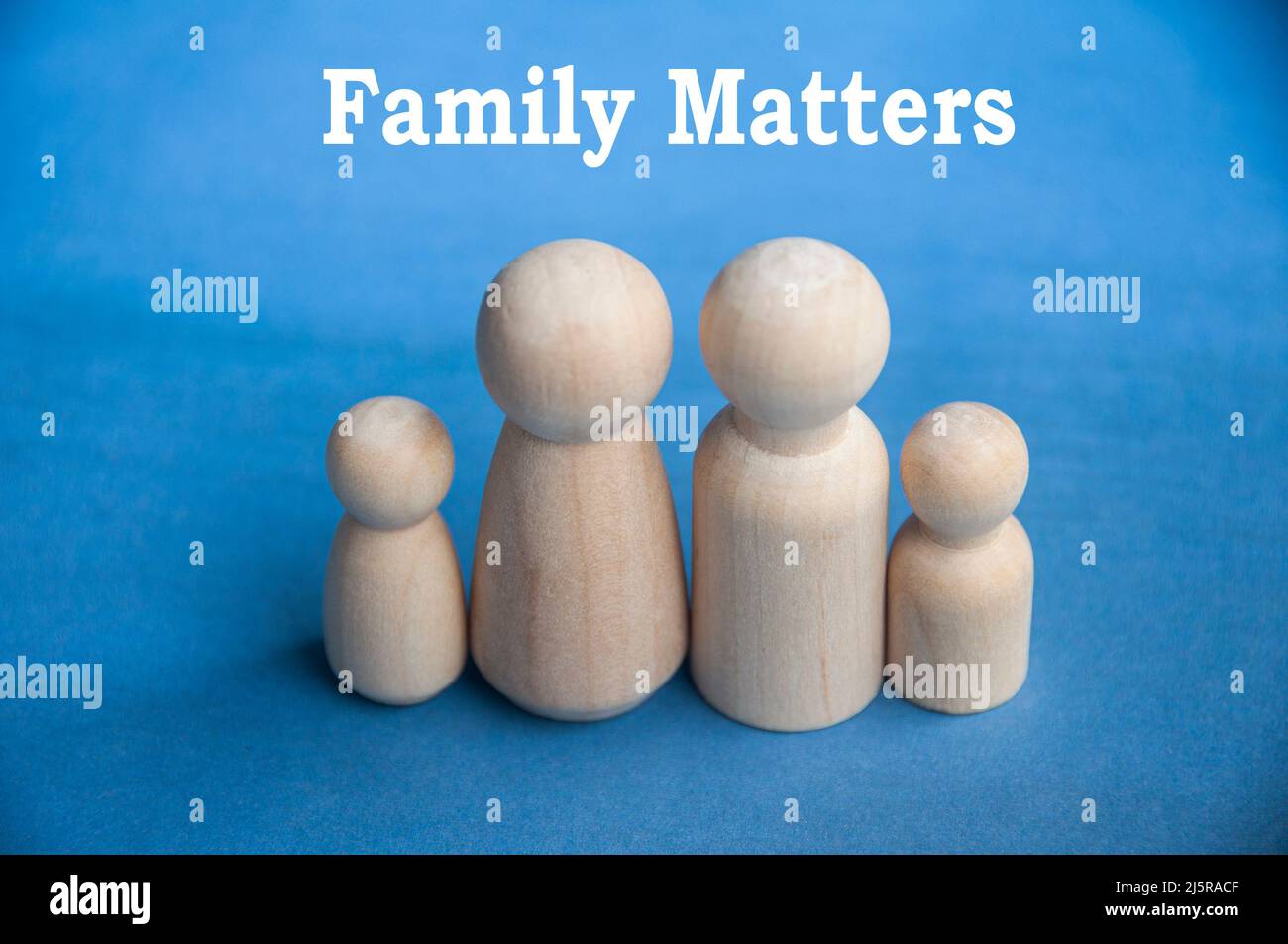 Family matter text with family wooden dolls. Family concept Stock Photo ...