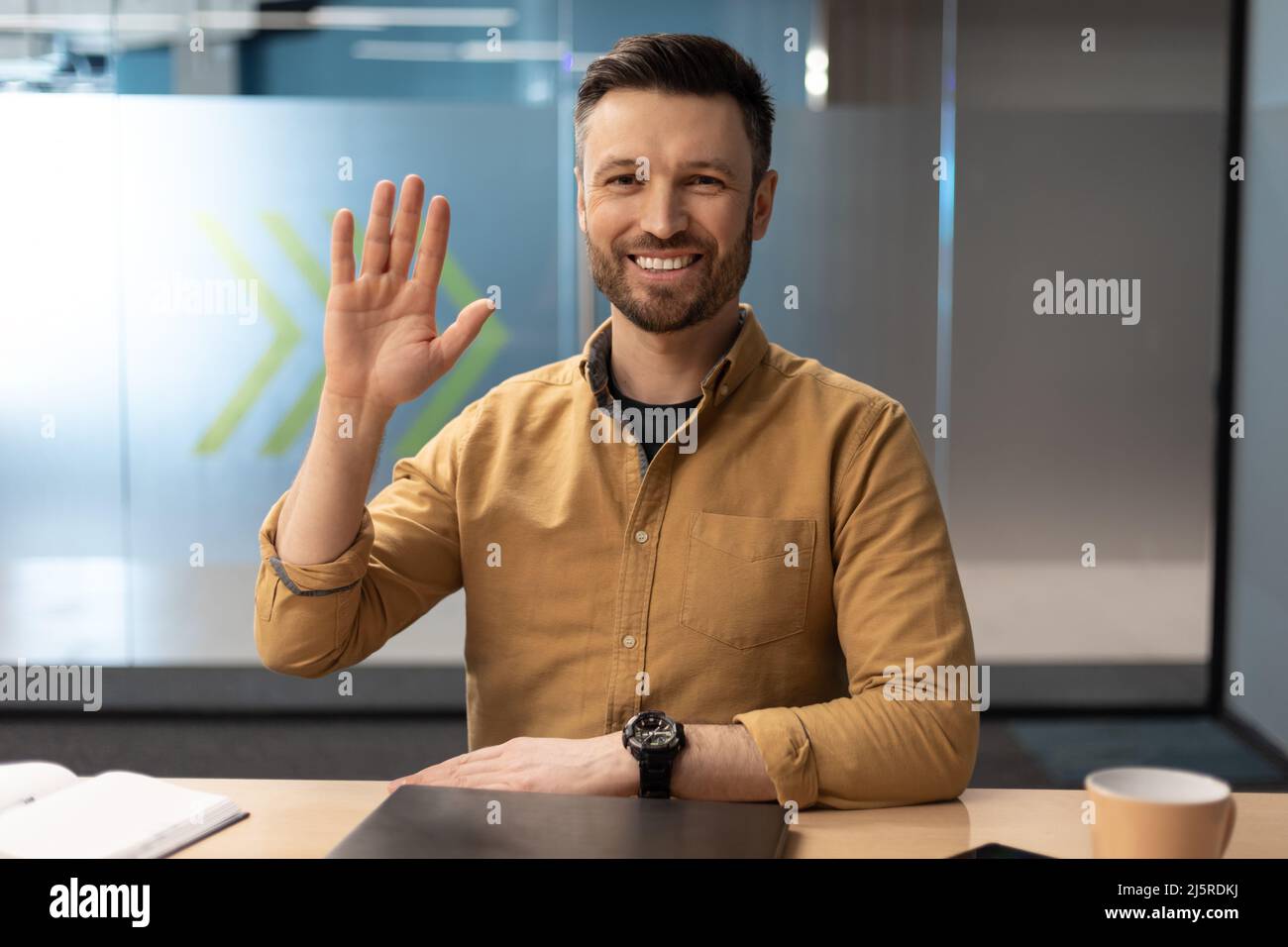 Office man waving hand hi-res stock photography and images - Alamy