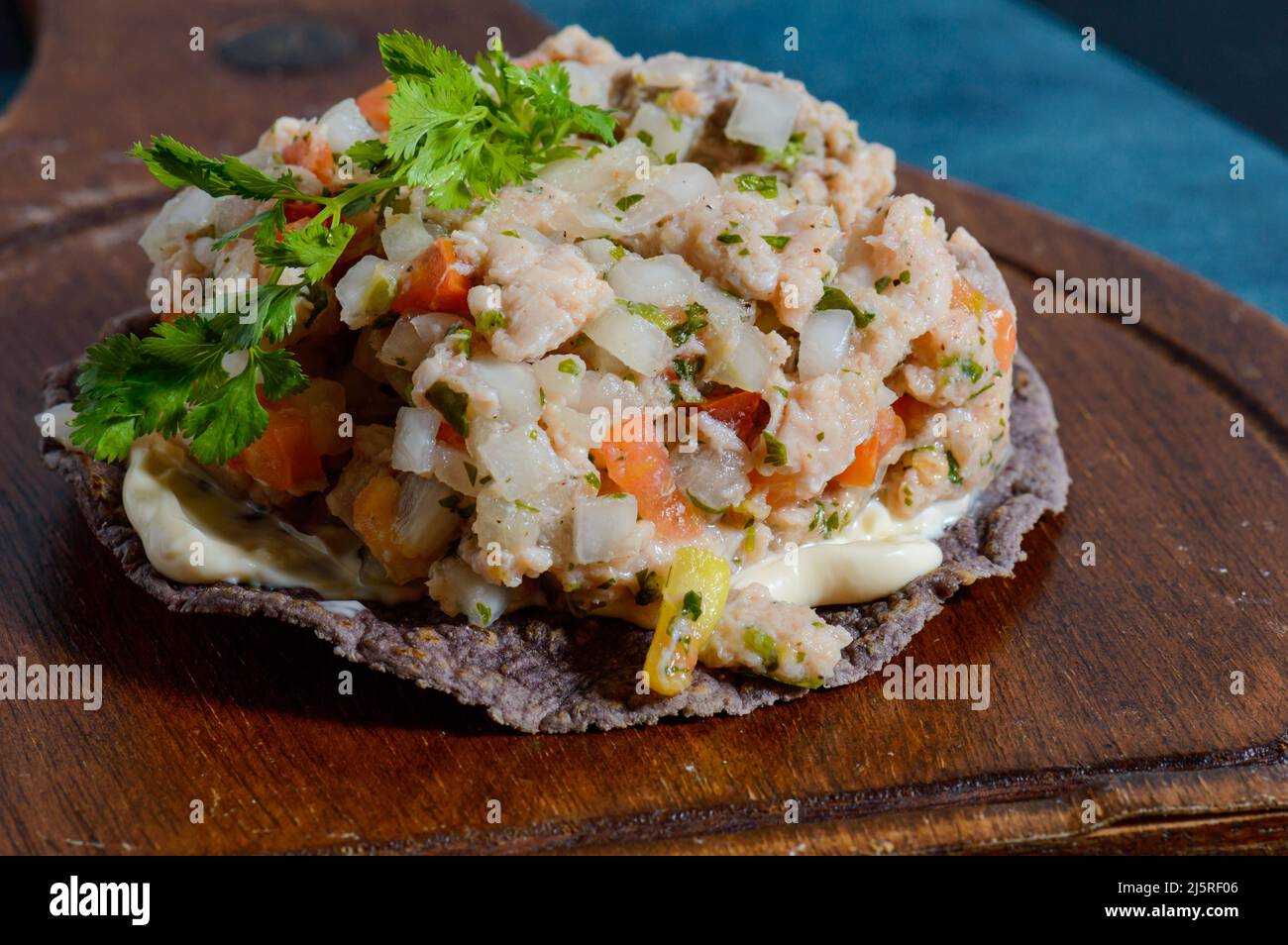 Fish ceviche on blue corn tostadas. Mexican food. Seviche made with ...