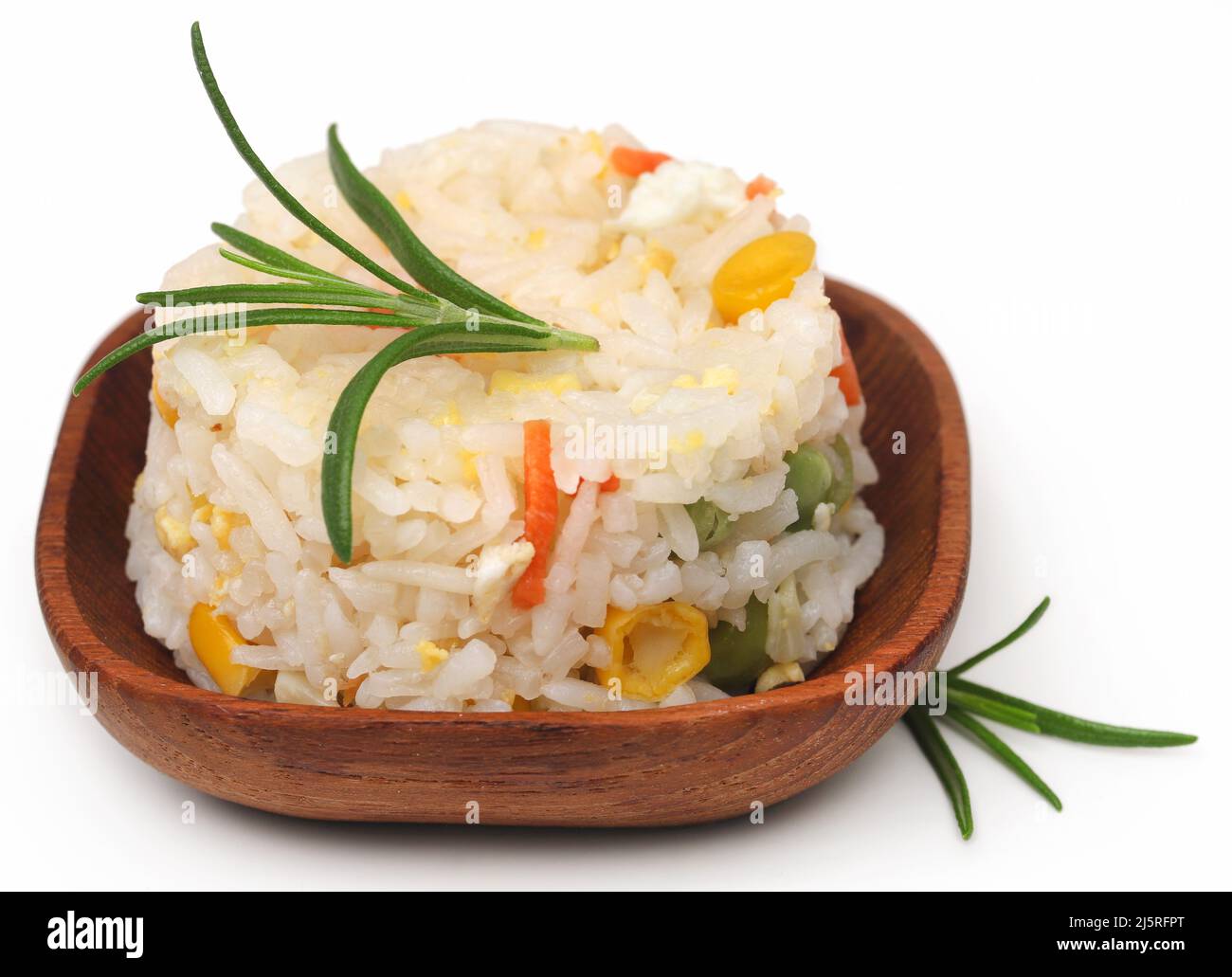 Fried rice with rosemary over white background Stock Photo - Alamy