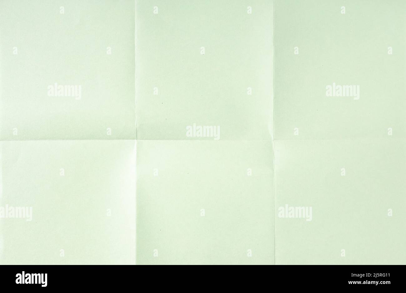 Light green crumpled unfolded paper sheet texture background. Paper ...