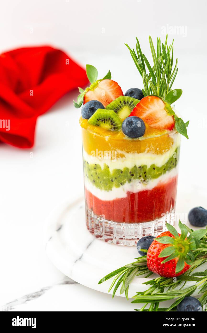 Strawberry, kiwi and mango smoothies with natural yogurt in glasses ...