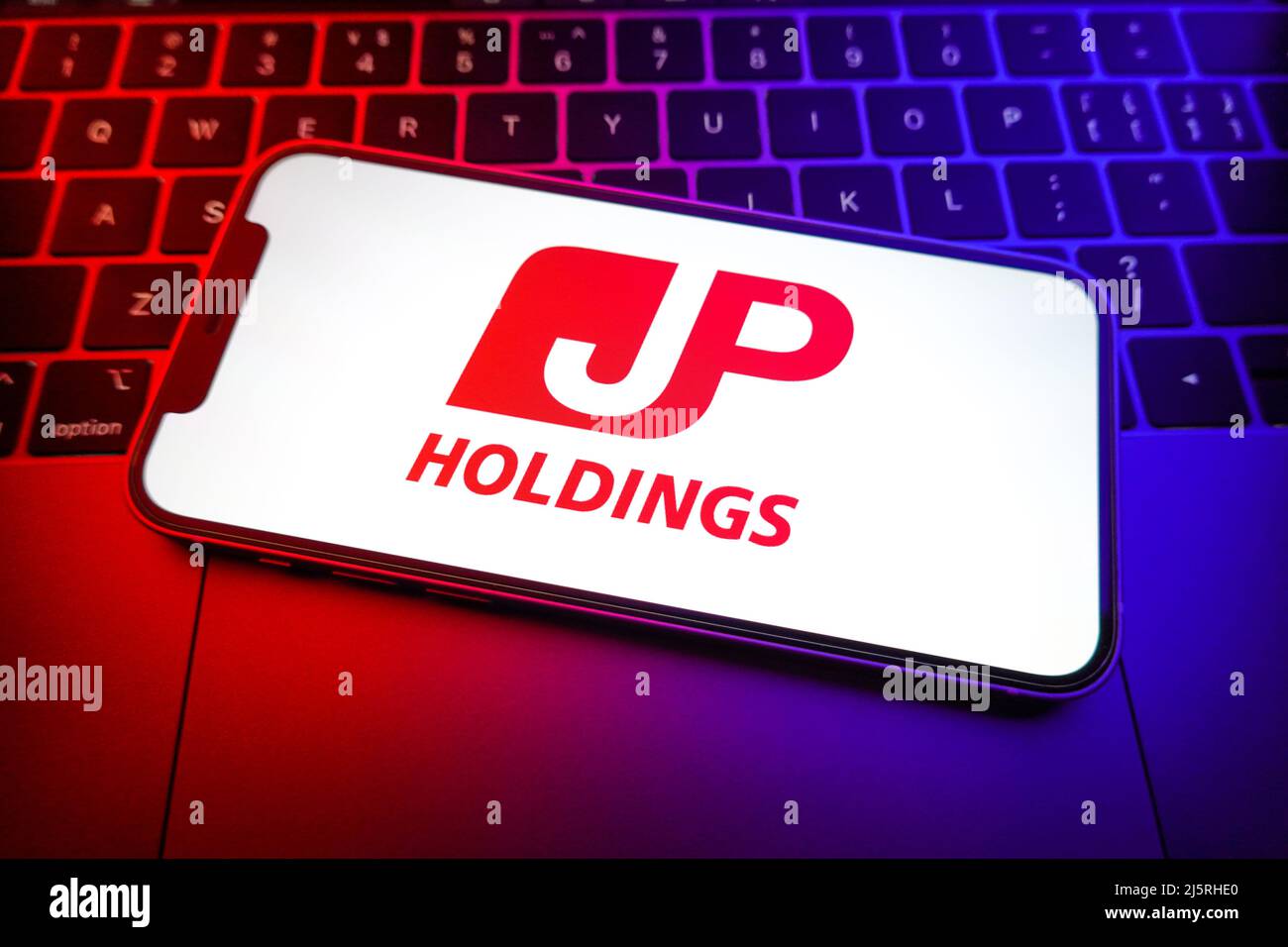 In this photo illustration, a Japan Post Holdings logo seen displayed ...