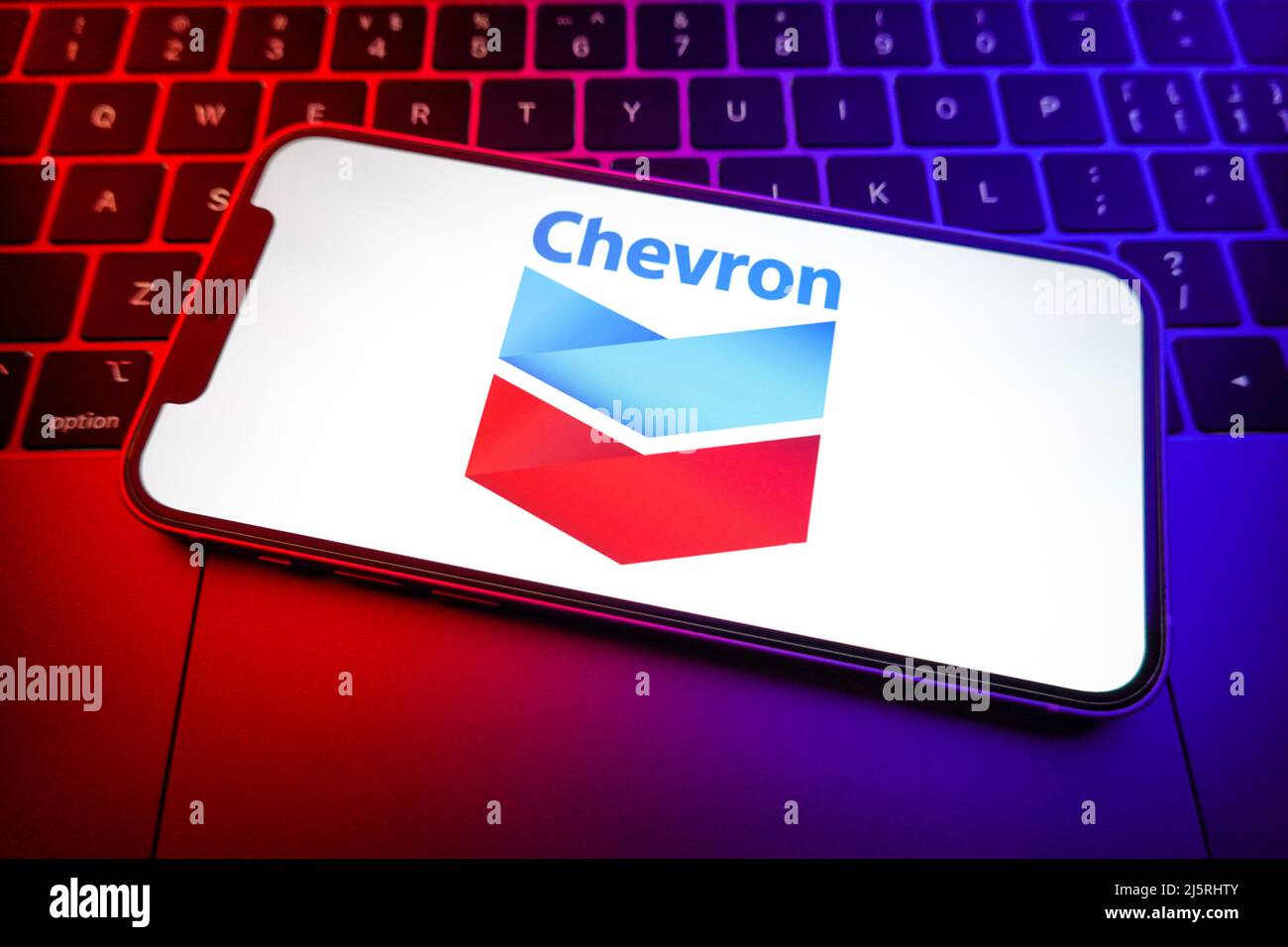 In this photo illustration, a Chevron logo seen displayed on a ...