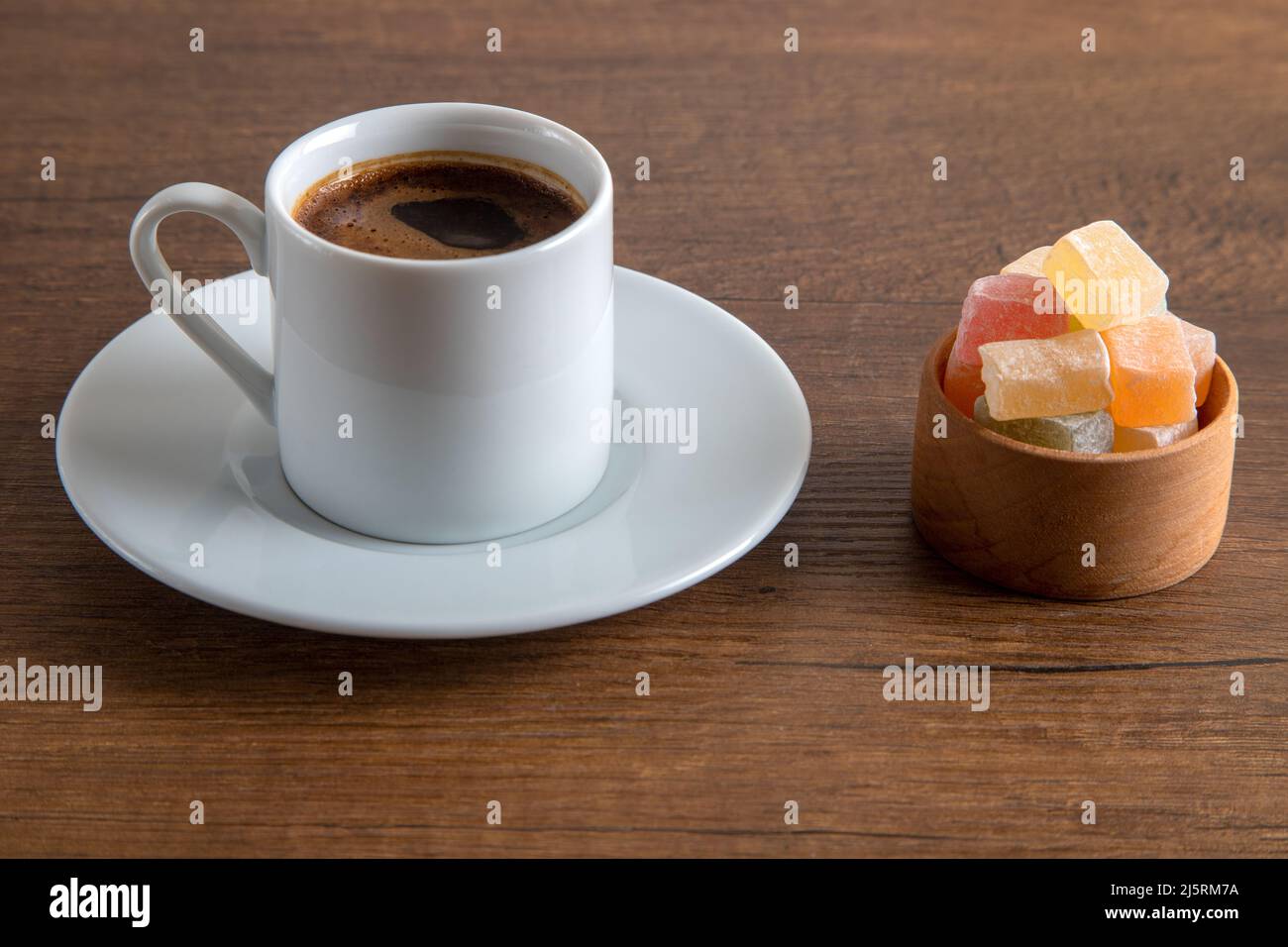 Traditional Turkish delight and Turkish coffee on a wooden background ...