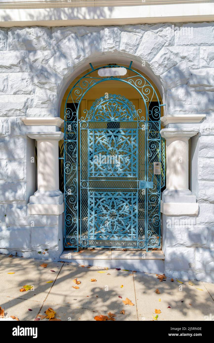 Arched blue metal gate with pillars on both sides in San Francisco ...