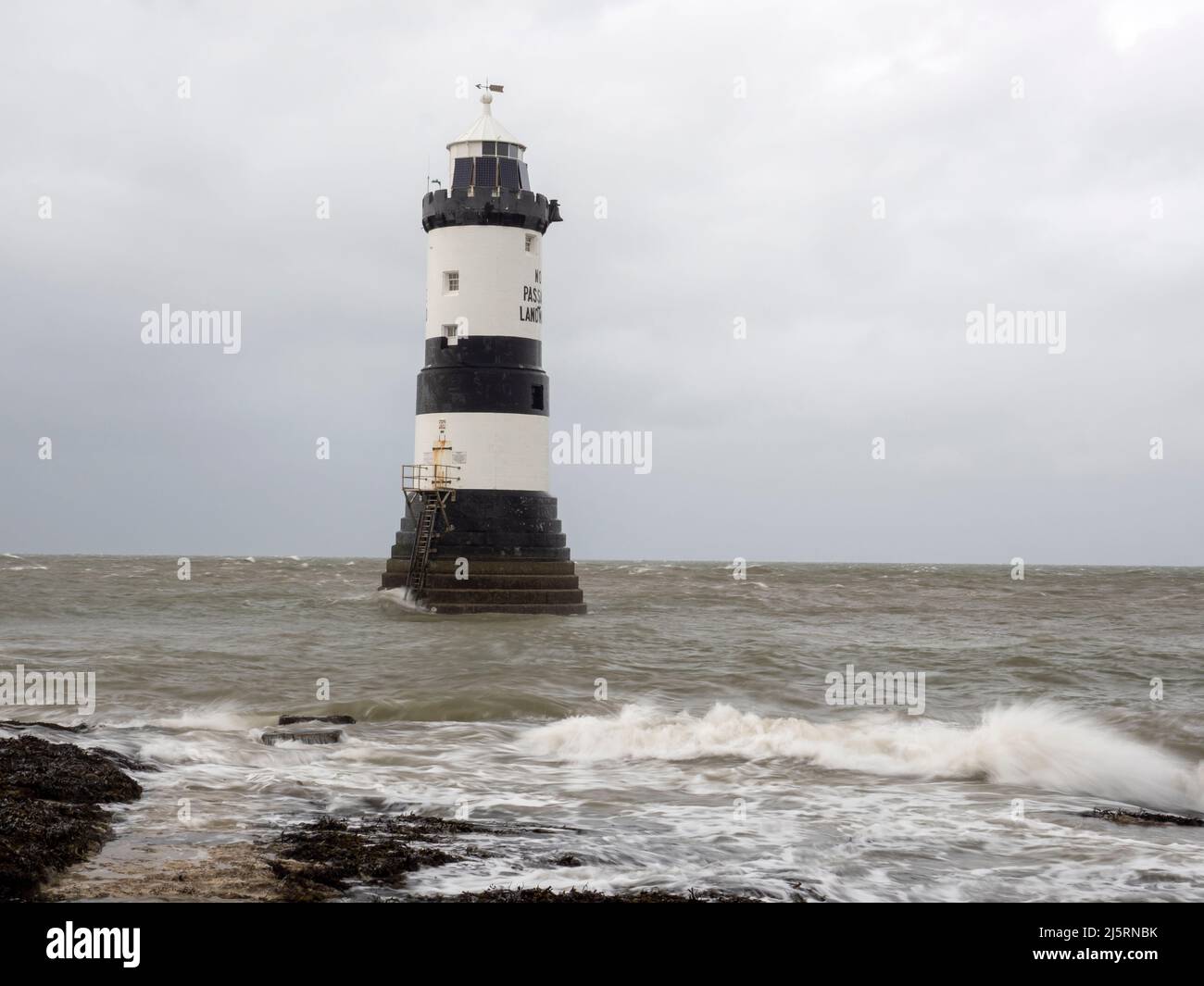 A lighthouse at Penmon Point on Anglesey, Wales, UK Stock Photo - Alamy