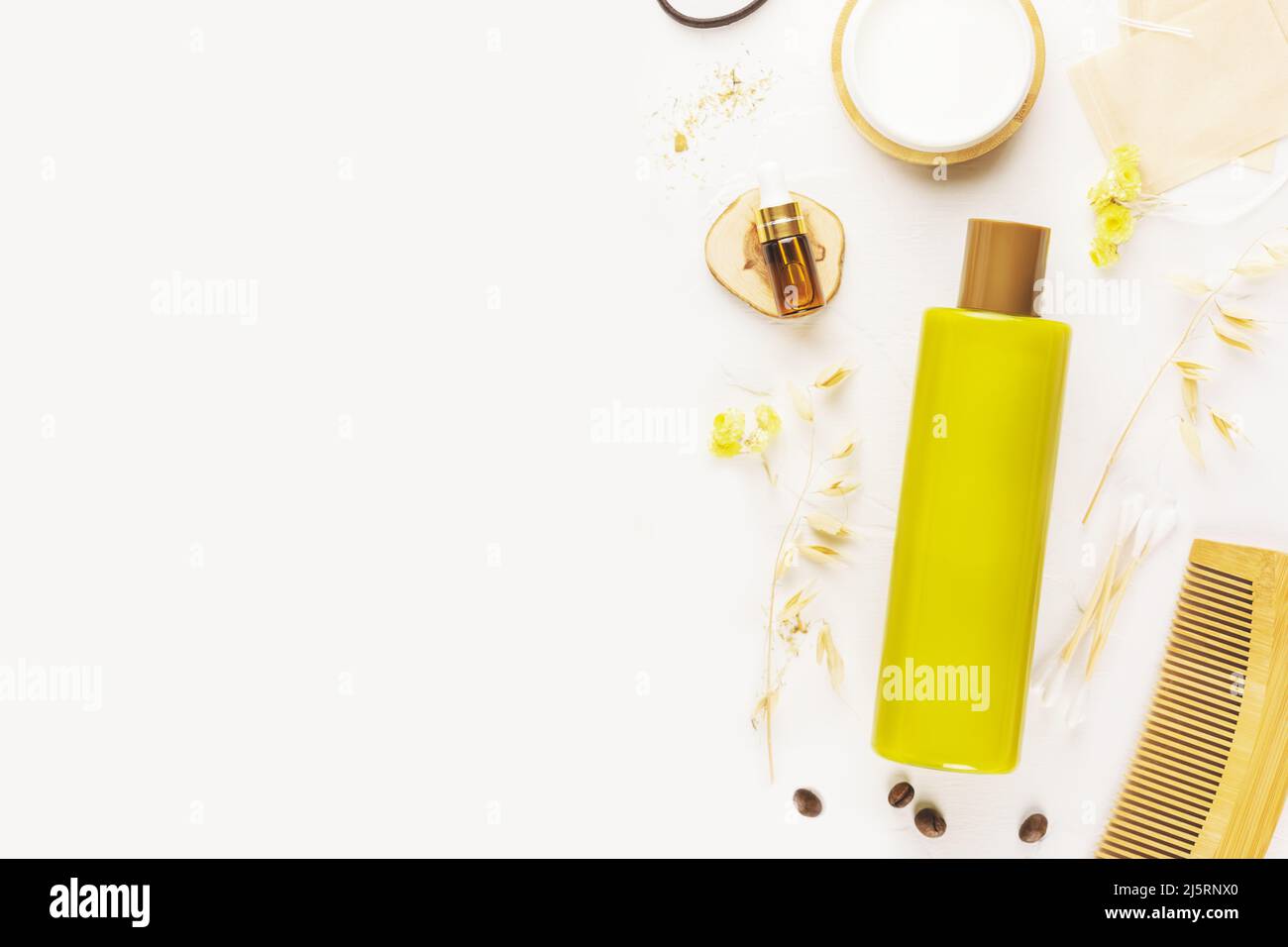 Hair cosmetics. Hair care card with organic shampoo bottle, combs, oil ...