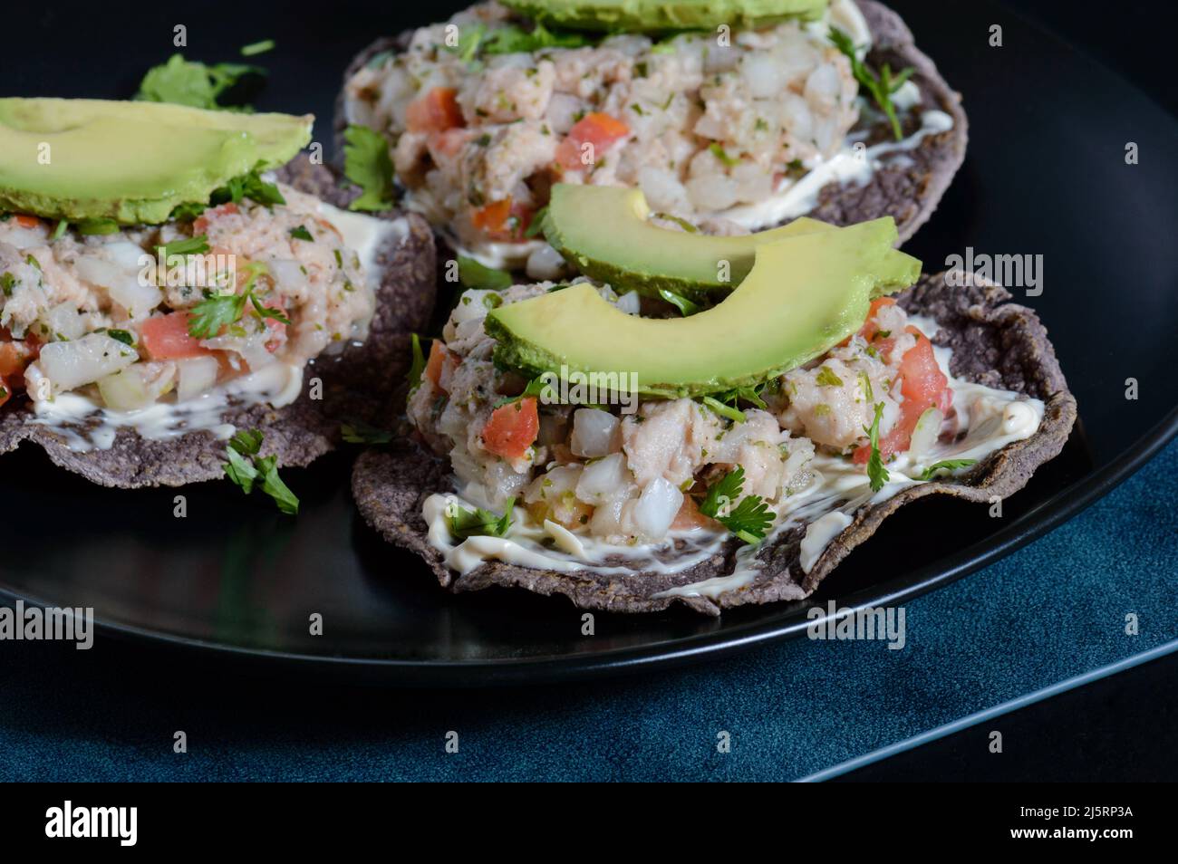 Fish ceviche on blue corn tostadas. Mexican food. Seviche made with ...