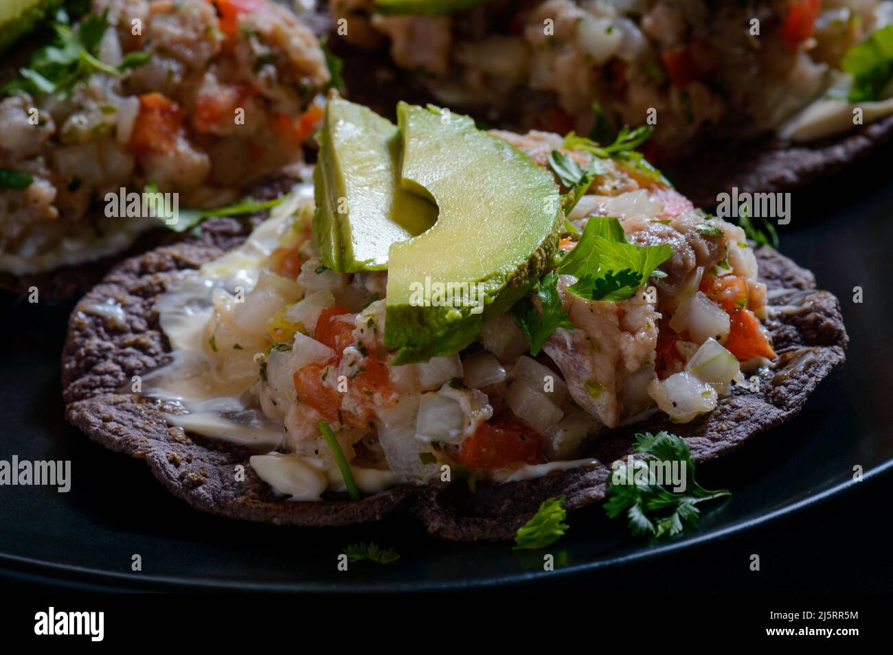Fish ceviche on blue corn tostadas. Mexican food. Seviche made with ...