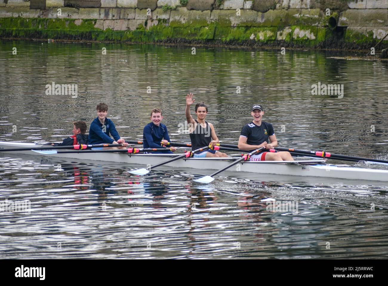 Young people rowing in Cork city Stock Photo - Alamy