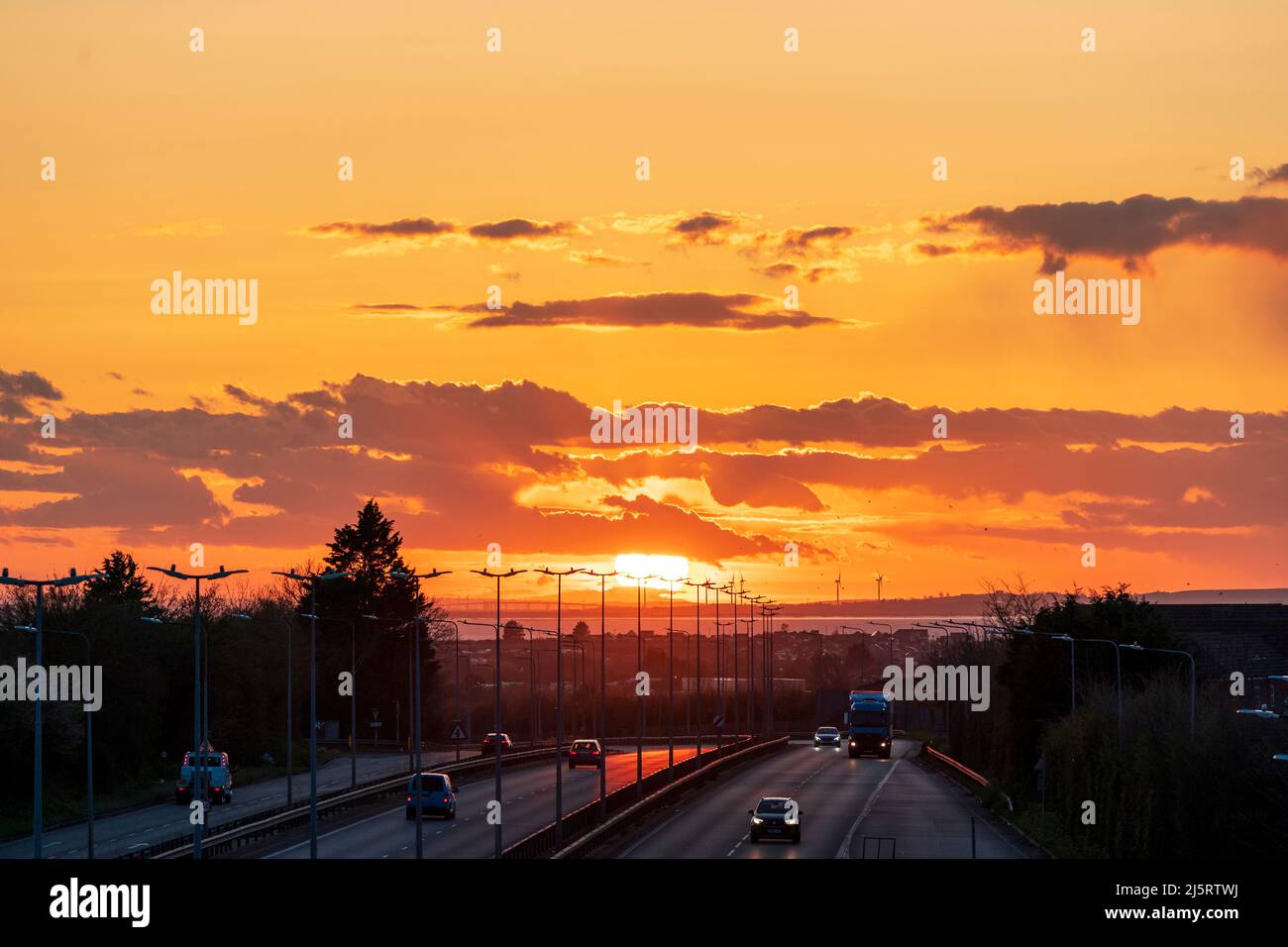 Sunset in a cloudy orange sky over the A299, Thanet Way dual ...