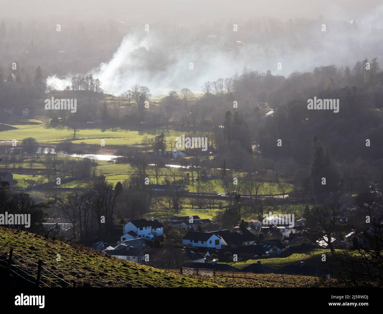 Smoke from a fire burning trees that were blown over by storm Arwen ...