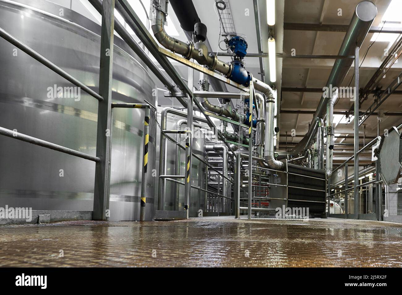 Tanks of stainless steel and heat-exchange unit at plant Stock Photo ...
