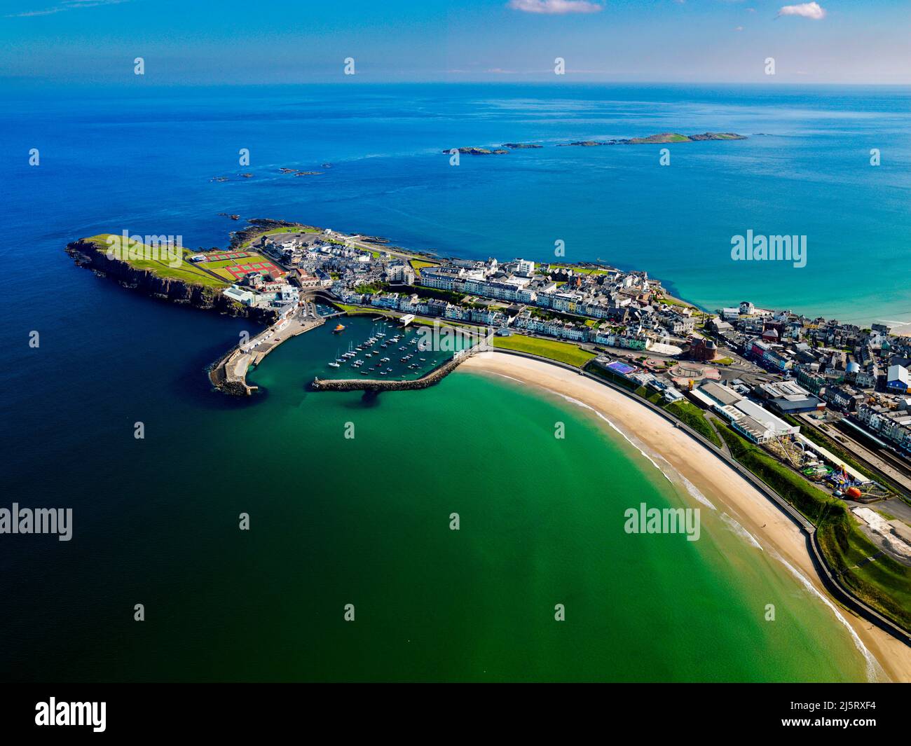 Aerial of Portrush showing the harbour and the West Strand, County ...